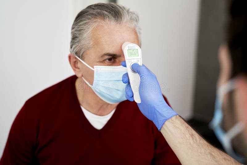 Close Up of Doctor Measuring the Temperature of the Senior Stock Image ...
