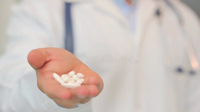The Close Up of Doctor Offering Tablets in Hand Stock Footage - Video ...