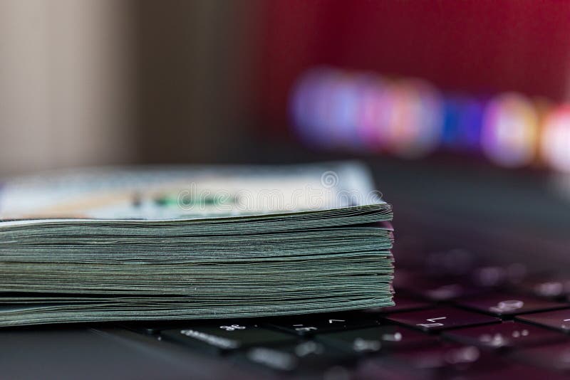 Close Up of Dollars Banknotes Money on Keyboard of Laptop on Table ...