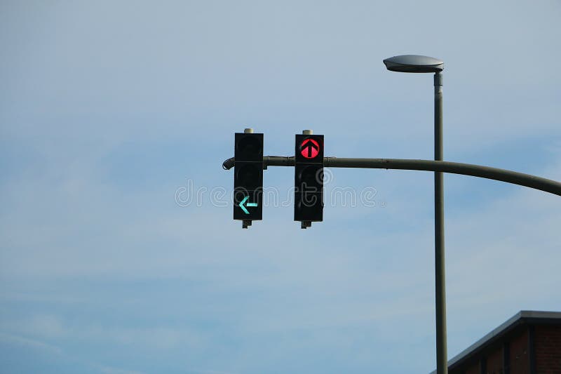 Close Up of Double Traffic Light Green for Left Turn and Red for ...