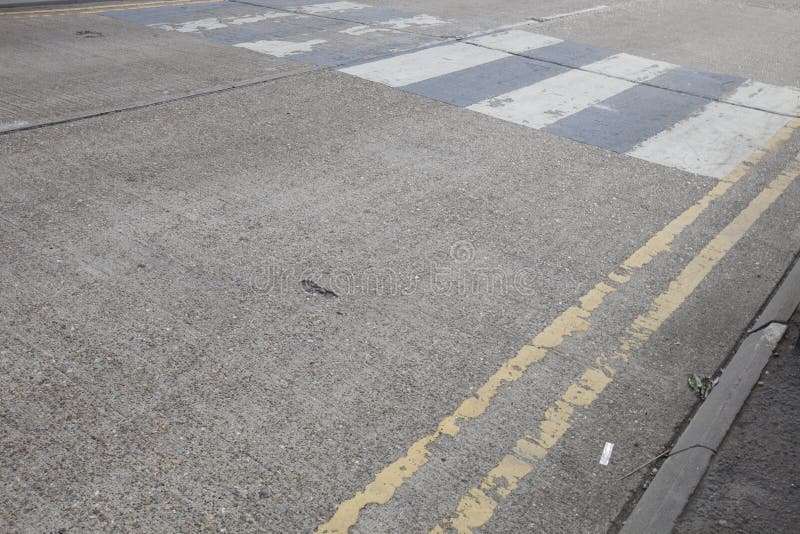 Close-Up of Double Yellow Line on Road and Zebra Crossing Stock Photo ...