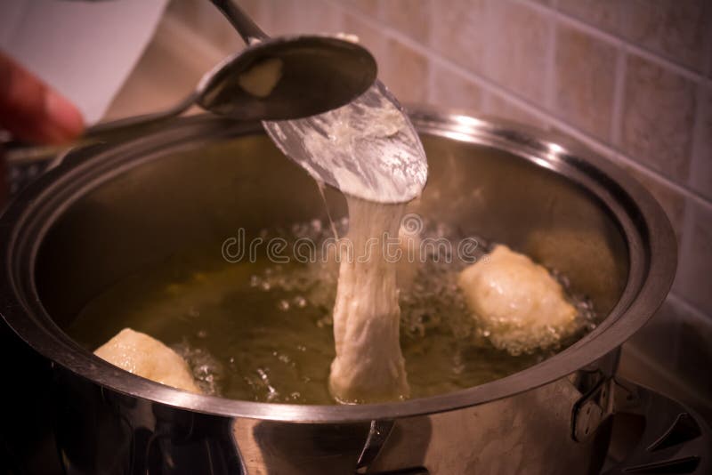 Close Up of Dough Which Slips into the Pot from a Spoon during T Stock ...