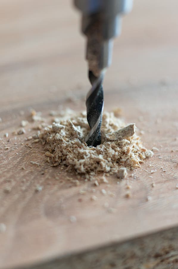Close-up of a Drill Bit Boring into Wood, Creating Sawdust Stock Photo ...