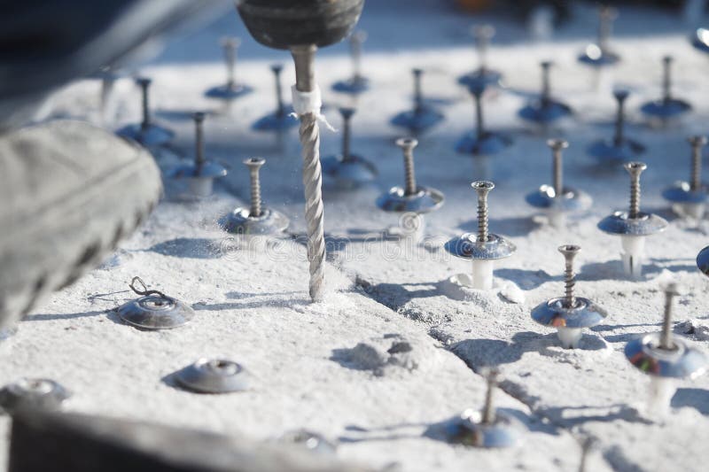 Close-Up of Drilling Process on a Concrete Base with Fasteners Stock ...
