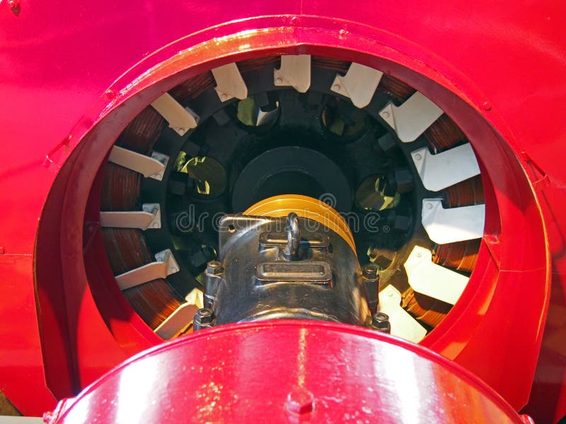 The Drive Shaft and Coils of a Large Red Industrial Generator Stock ...