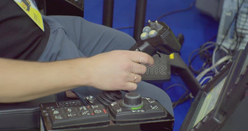 Close-up, the Driver Controls the Car with the Joystick.the Worker ...