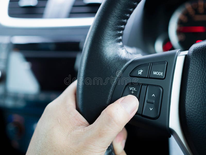 Driver`s Hands Press Volume Button on a Steering Wheel Stock Image ...
