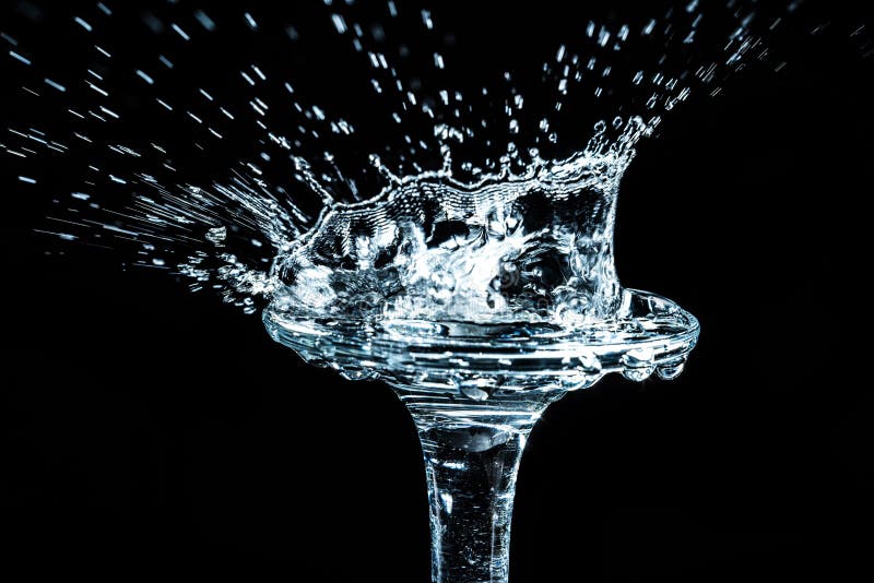 Close-up a Drop of Water is Split on the Glass in the Form of a Crown ...