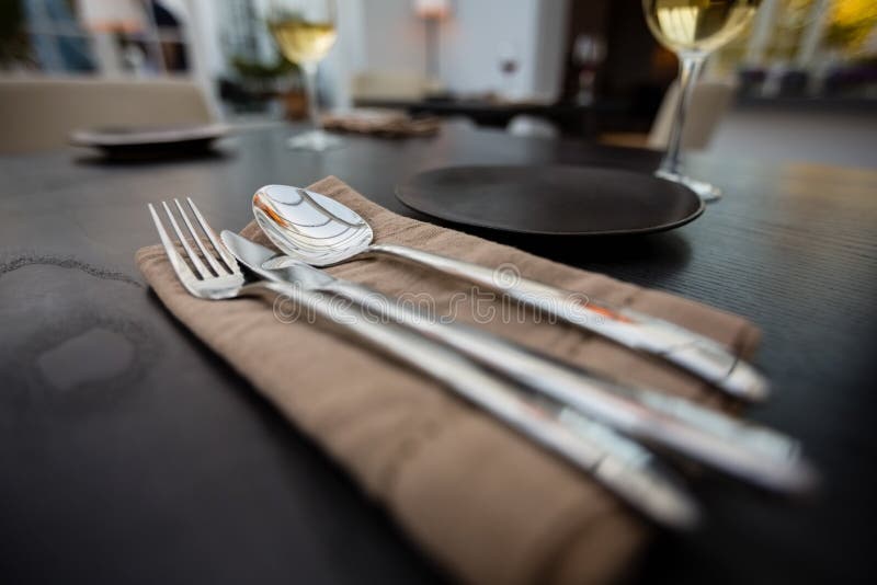 Close Up of Eating Utensils and Napkin on Table Stock Photo - Image of ...