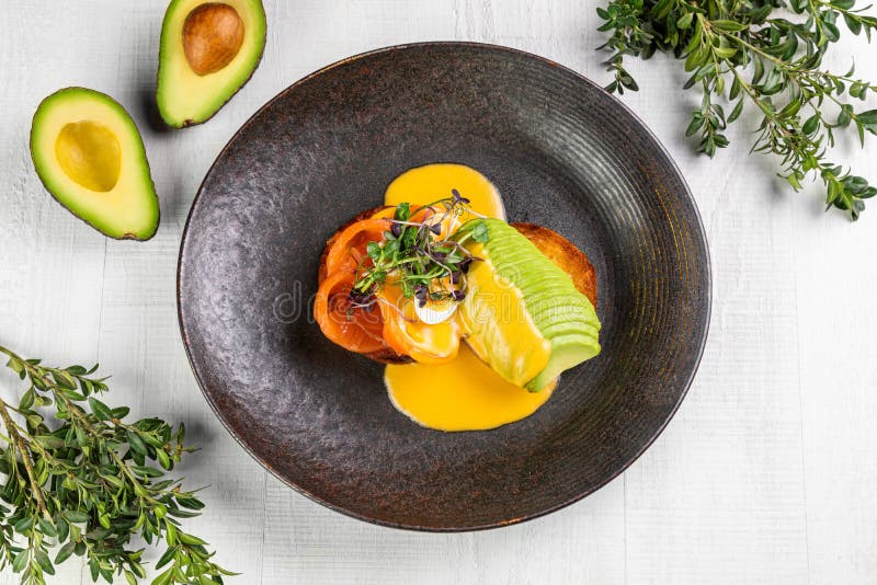 Close-up of Egg Benedict with Ham, Eggs Florentine Close Up on a Black ...