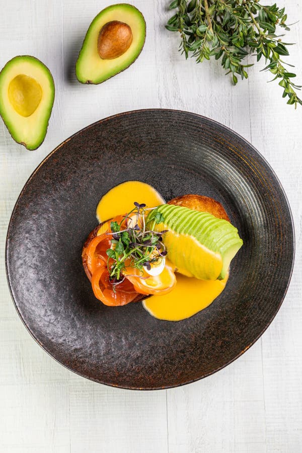 Close-up of Egg Benedict with Ham, Eggs Florentine Close Up on a Black ...