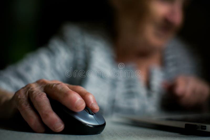 Close-up of an Elderly Woman S Hand Gently Resting on a Computer Mouse ...