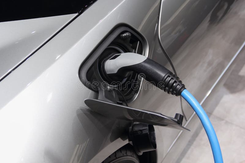 The Close Up of Electric Car Charging Plug, Charging Gray Car Stock ...