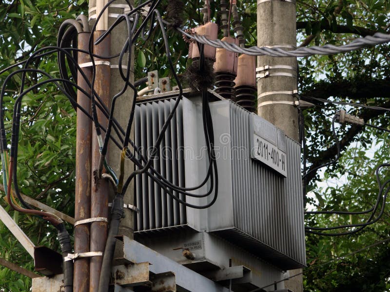 Close-up of an Electrical Transformer on a Utility Pole with Power ...