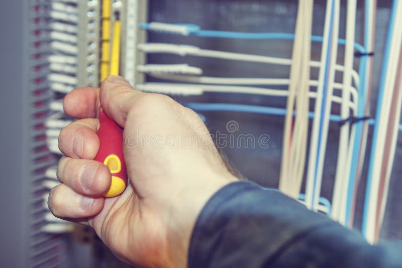 A Close-up Electrician Hand Performs Electrical Work. Stock Image ...