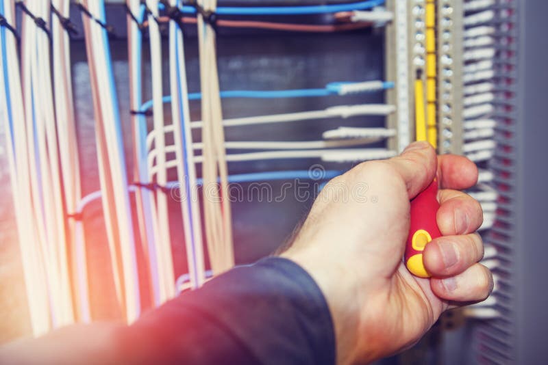 A Close-up Electrician Hand Performs Electrical Work. Stock Image ...