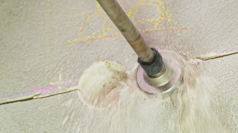 Close Up Electrician Using Rotary Hammer and Diamond Core Drill To ...
