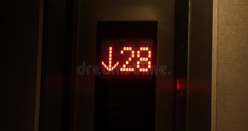 Close-up of Electronic Board in Elevator with a Floor Countdown and Red ...