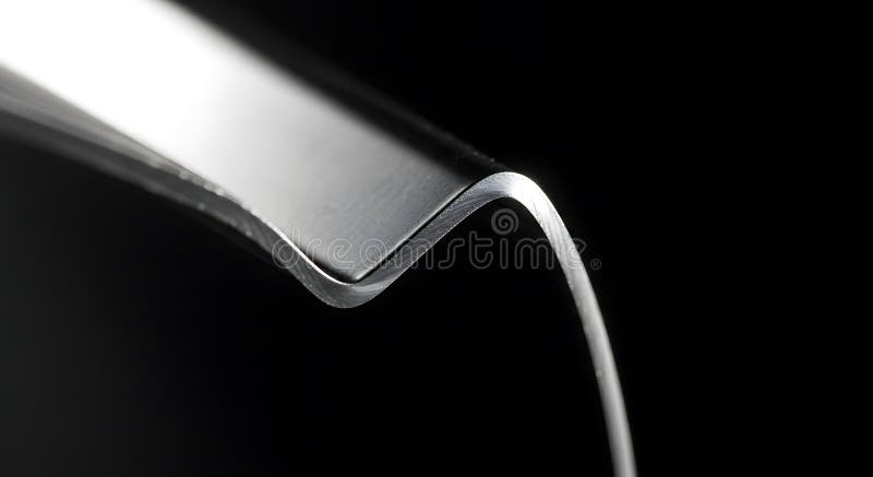 Close-up of the Elegant Curve of a Metallic Fork, with a Focus on the ...