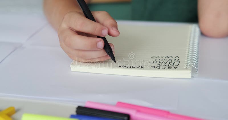 Close-up of an Elementary School Boy Hands Doing Homework at His Desk ...