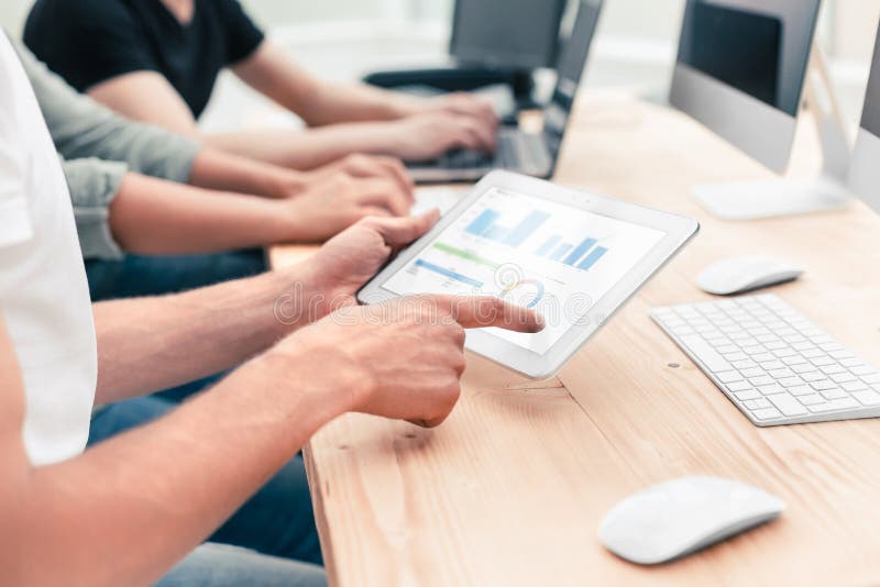 Close Up. the Employee Uses a Digital Tablet in the Workplac Stock ...