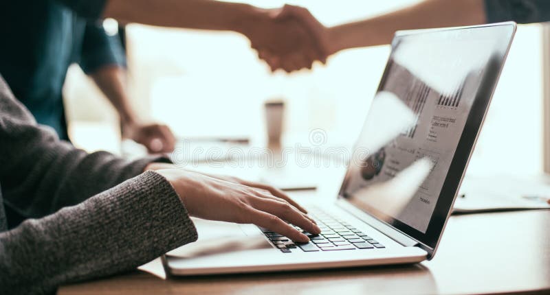 Close Up. Employee Using a Laptop at the Workplace in the Office Stock ...