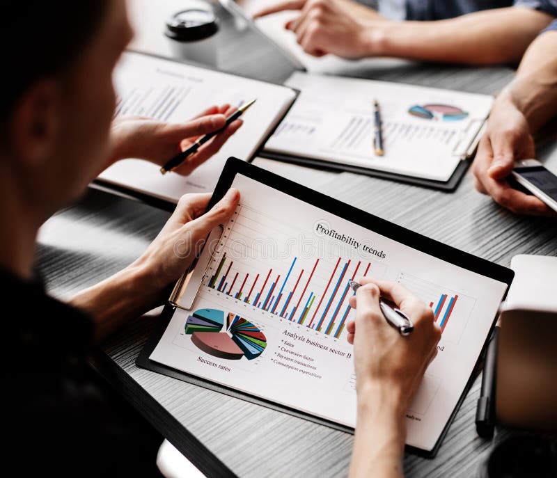 Close Up. Employees Discussing Financial Documents at the Workplace ...