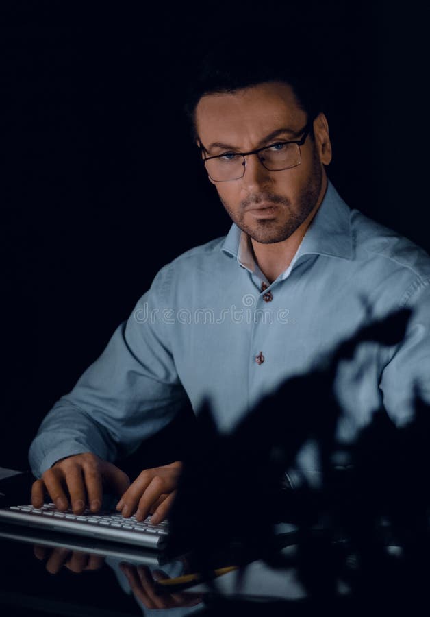 Close Up.employees Work on Computers in a Dark Office Stock Photo ...