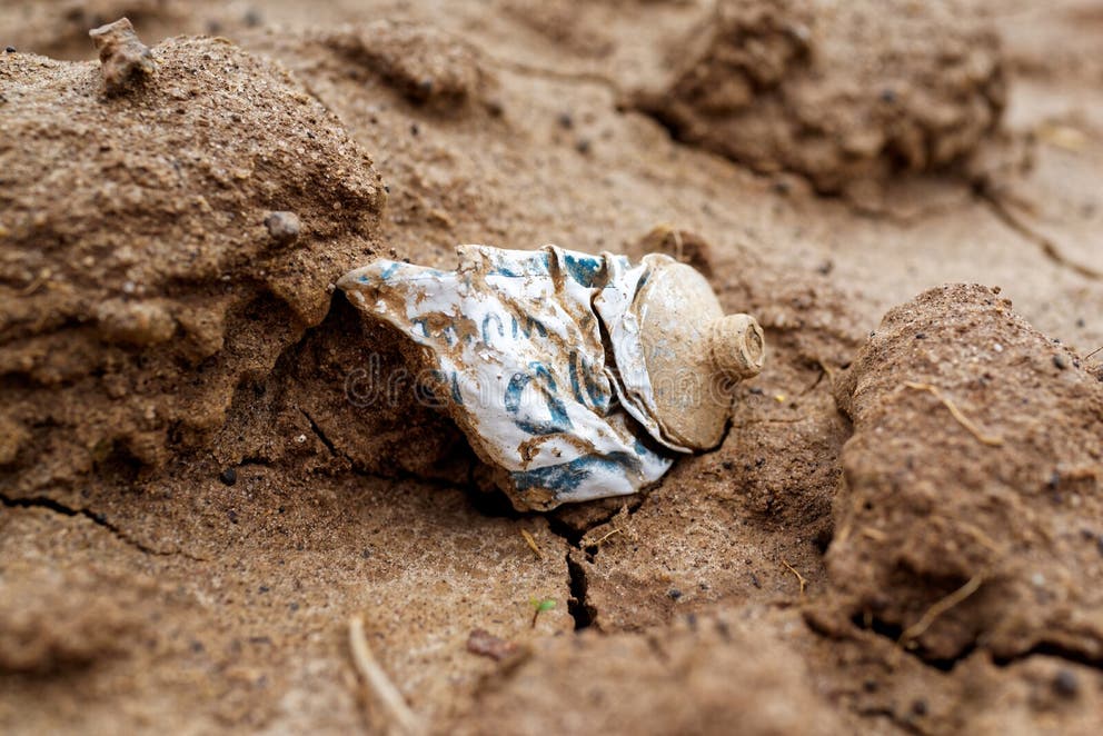 Empty Tube of Paint on Muddy Ground. Pollution Stock Photo - Image of ...