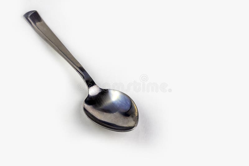 Close-up. Empty Steel Spoon on a White Background Stock Photo - Image ...