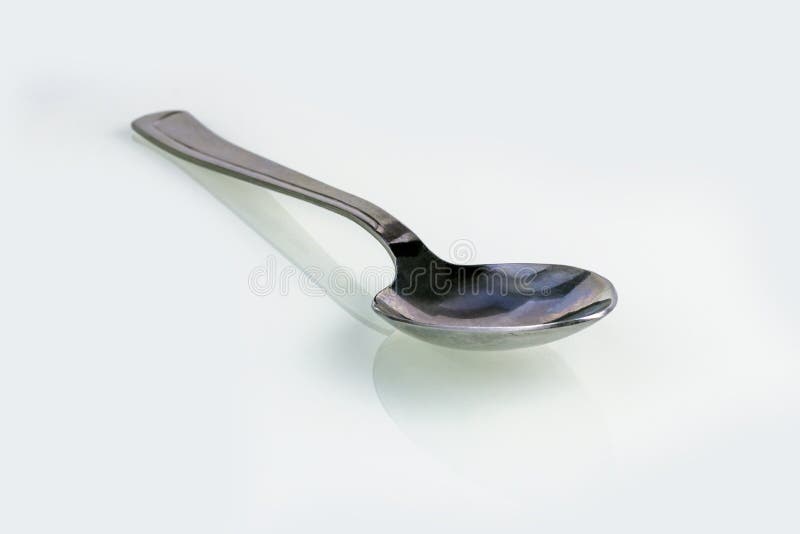 Close-up. Empty Steel Spoon on a White Background Stock Photo - Image ...