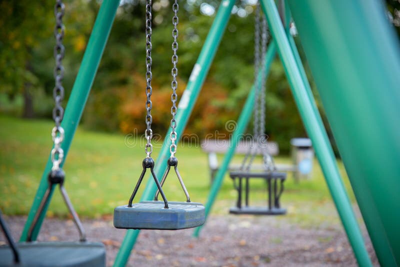 Close Up of Empty Swing Set in Public Park Stock Photo - Image of ...