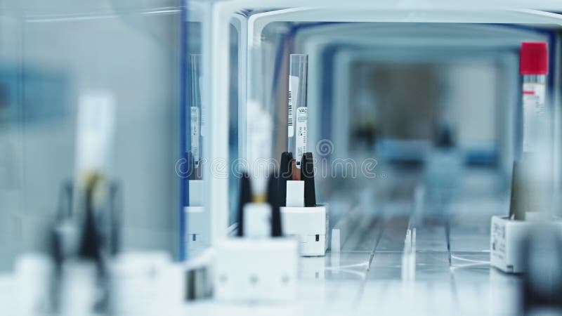 Close-up of Empty Test Tubes Moving Around Inside an Automated Lab ...
