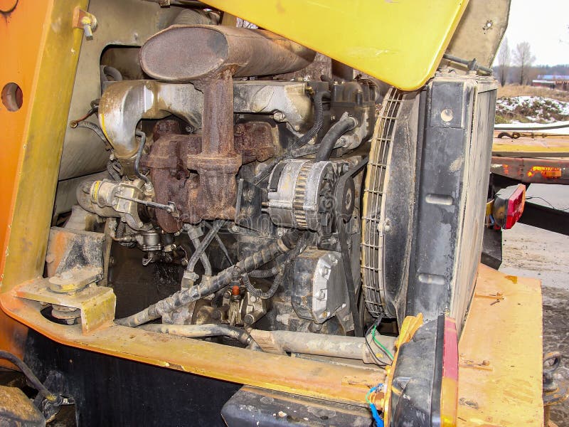 Close-up Shows the Engine and Radiator of a Yellow Construction Vehicle ...