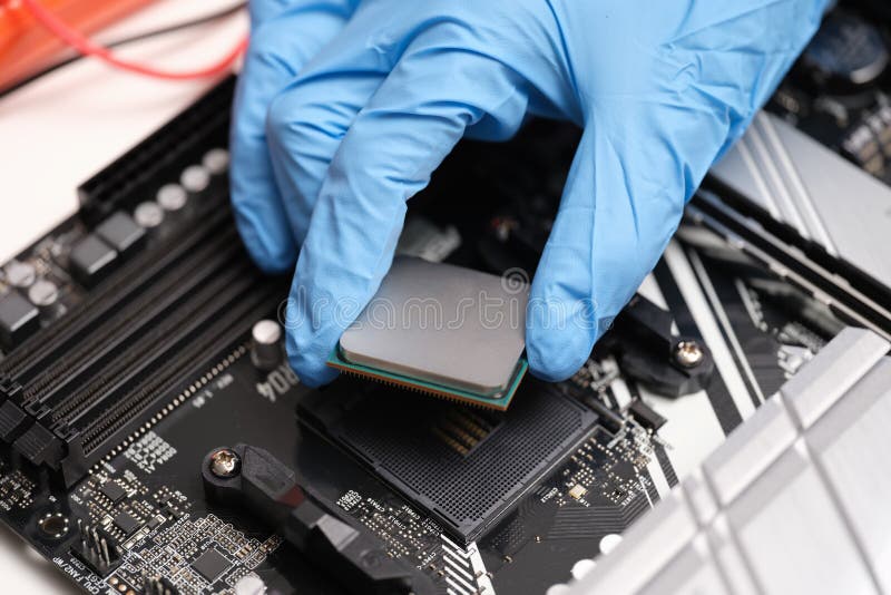 Engineer Hand Sets the Processor To the Motherboard Stock Photo - Image ...