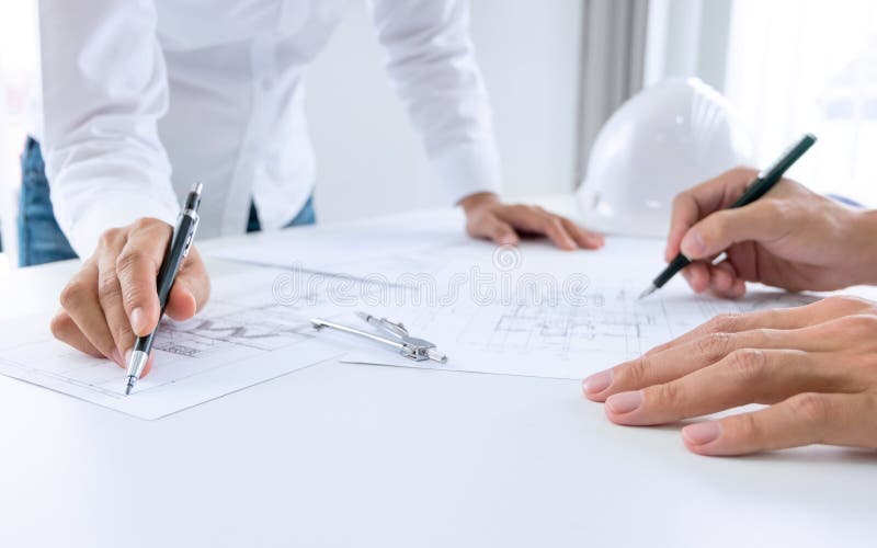 Close Up of Engineer Hands Discussing a Building Construction Project ...