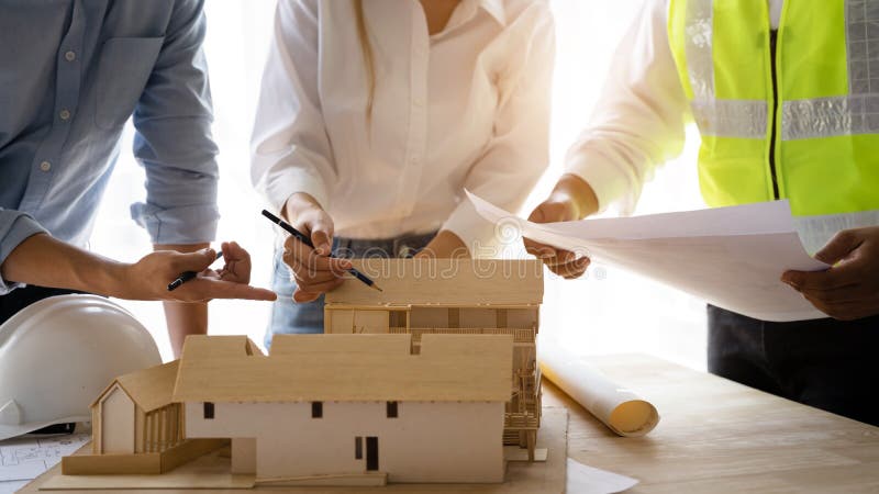 Close Up of Engineer Teams Hands Making Model House. Engineer Teams ...