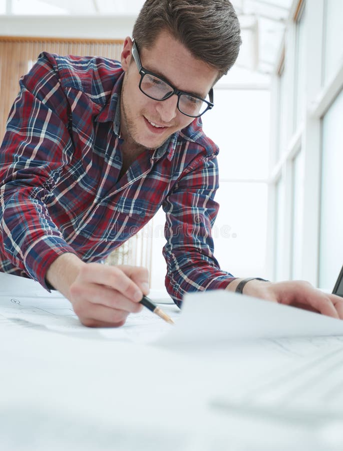 Close-up of Engineers Hands with Pens Over Blueprints with Sketches of ...