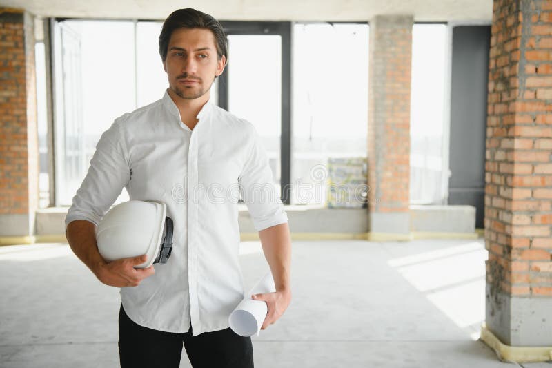 Close Up Engineers Working on a Building Site Holding a Blueprints ...