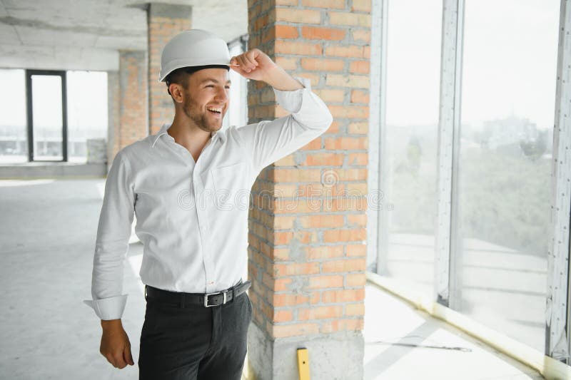 Close Up Engineers Working on a Building Site Holding a Blueprints ...