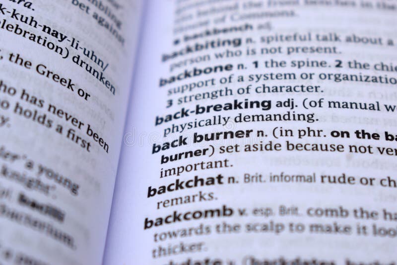 Close Up of English Dictionary Page with Definition Word -Back Burner ...