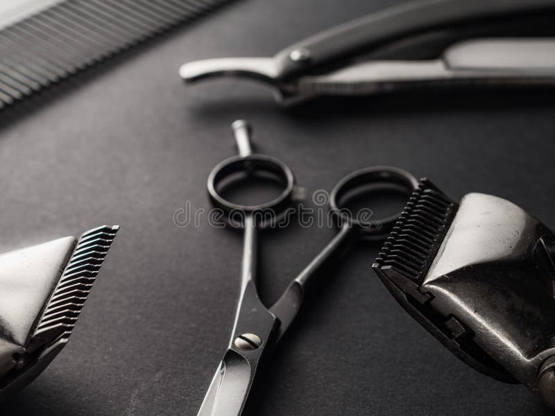 Close-up of Essential Barber Tools Including Scissors, Clippers, and a ...