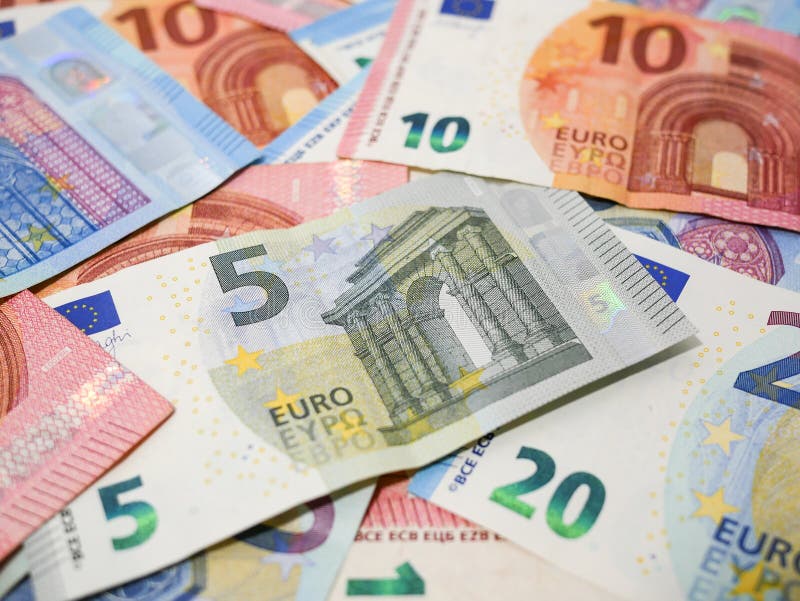 Various Euro Coins and Banknotes on a White Desk. Notes and Coins of ...
