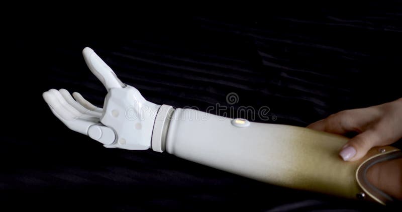 Close Up Examines and Checking Movement of Fingers High-tech Bionic Arm ...