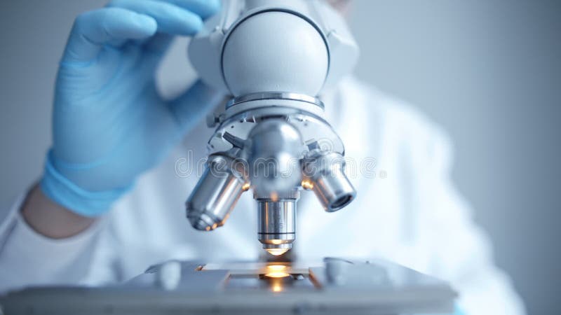 Close Up of Examining of Test Sample Under the Microscope Stock Footage ...