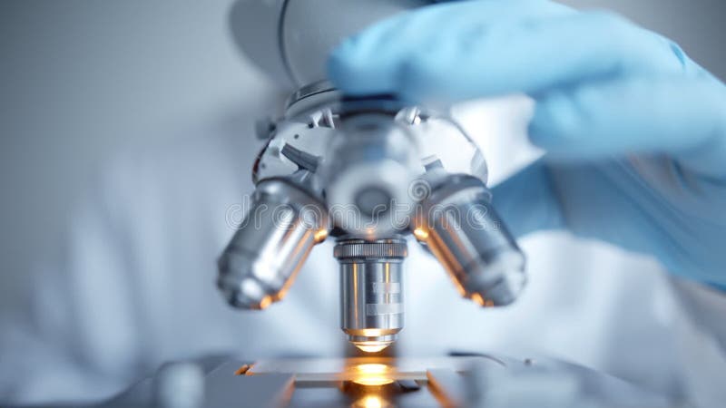 Close Up of Examining of Test Sample of Microchip Transistor Under the ...