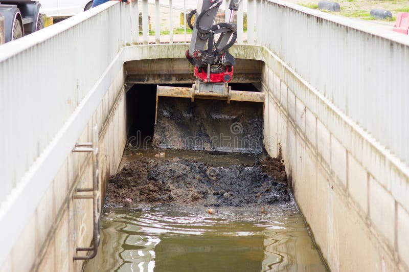 Excavator Bucket Digging Mud and Dirt Stock Photo - Image of equipment ...