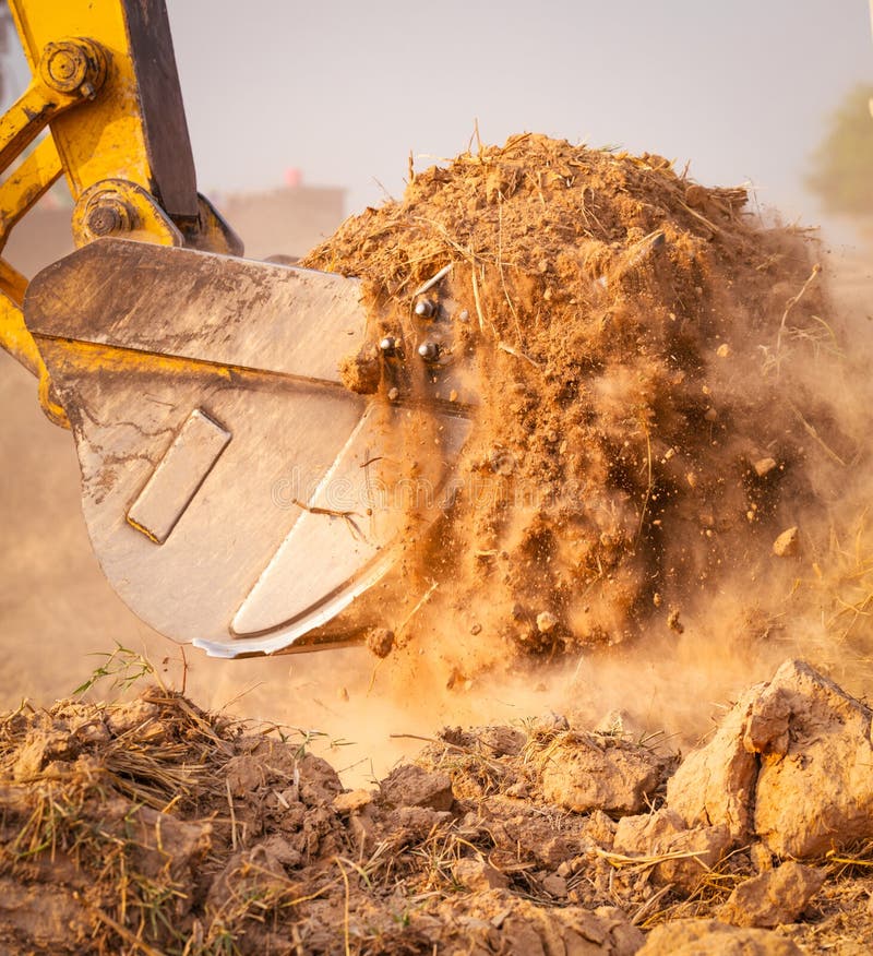 Close-up of Excavator at Construction Site. Backhoe Digging Soil for ...