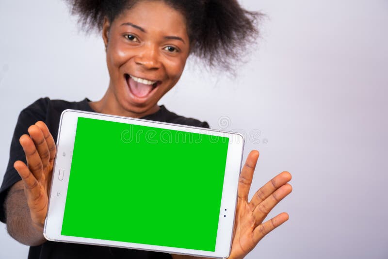 Close Up of an Excited African Lady Holding a Tablet Computer with the ...