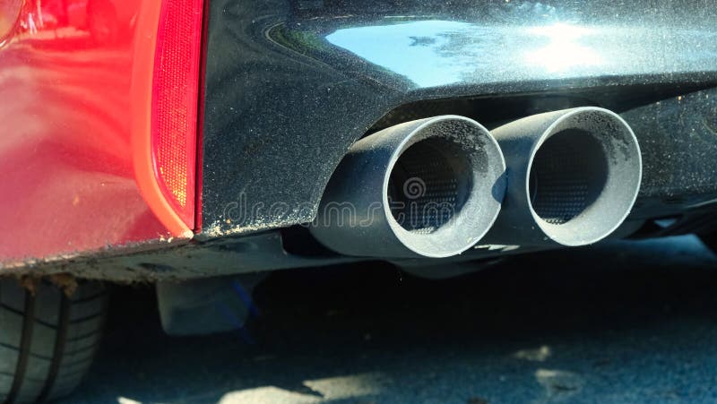 Close Up of Exhaust Pipe of a Red Car. Twin Exhaust Pipes Stock Image ...